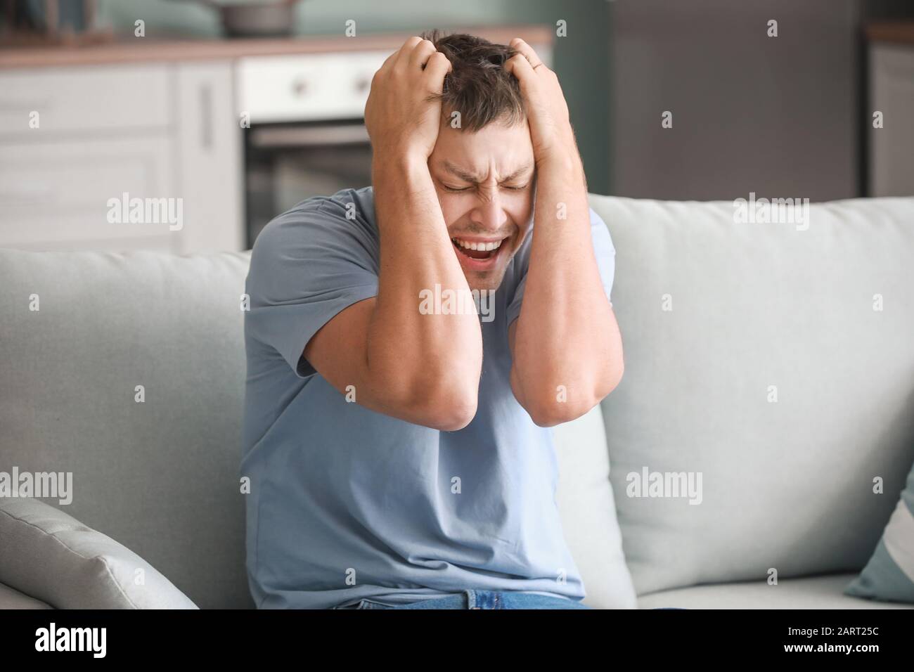 Frustrated man screaming home hi-res stock photography and images - Alamy