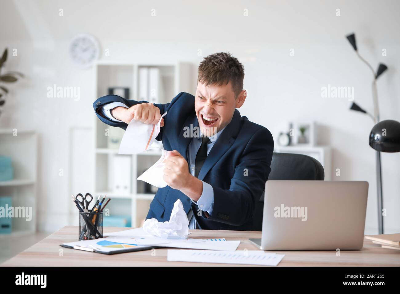 Angry businessman tearing paper hi-res stock photography and images - Alamy