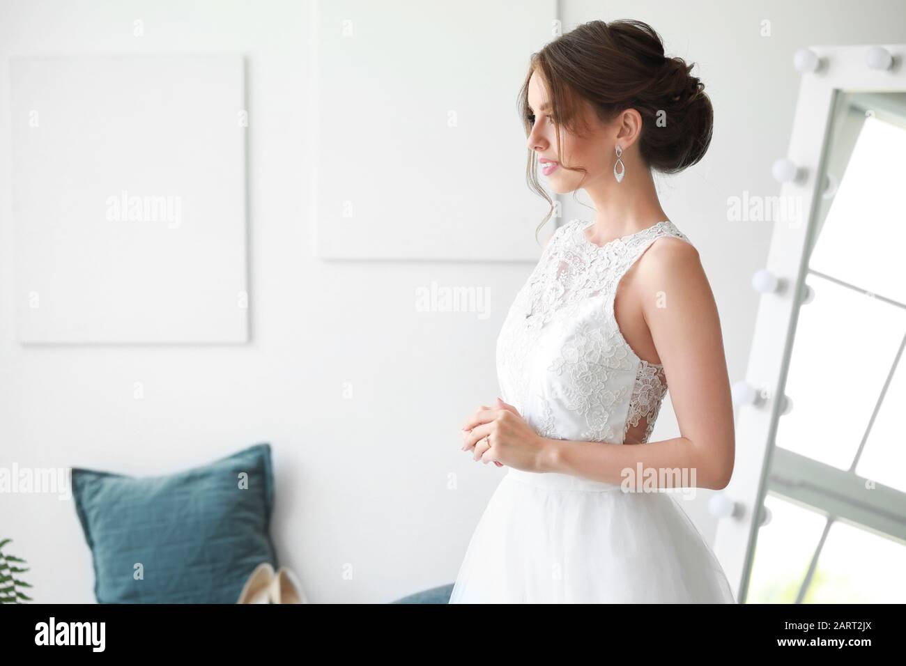 Beautiful young bride before wedding ceremony at home Stock Photo - Alamy