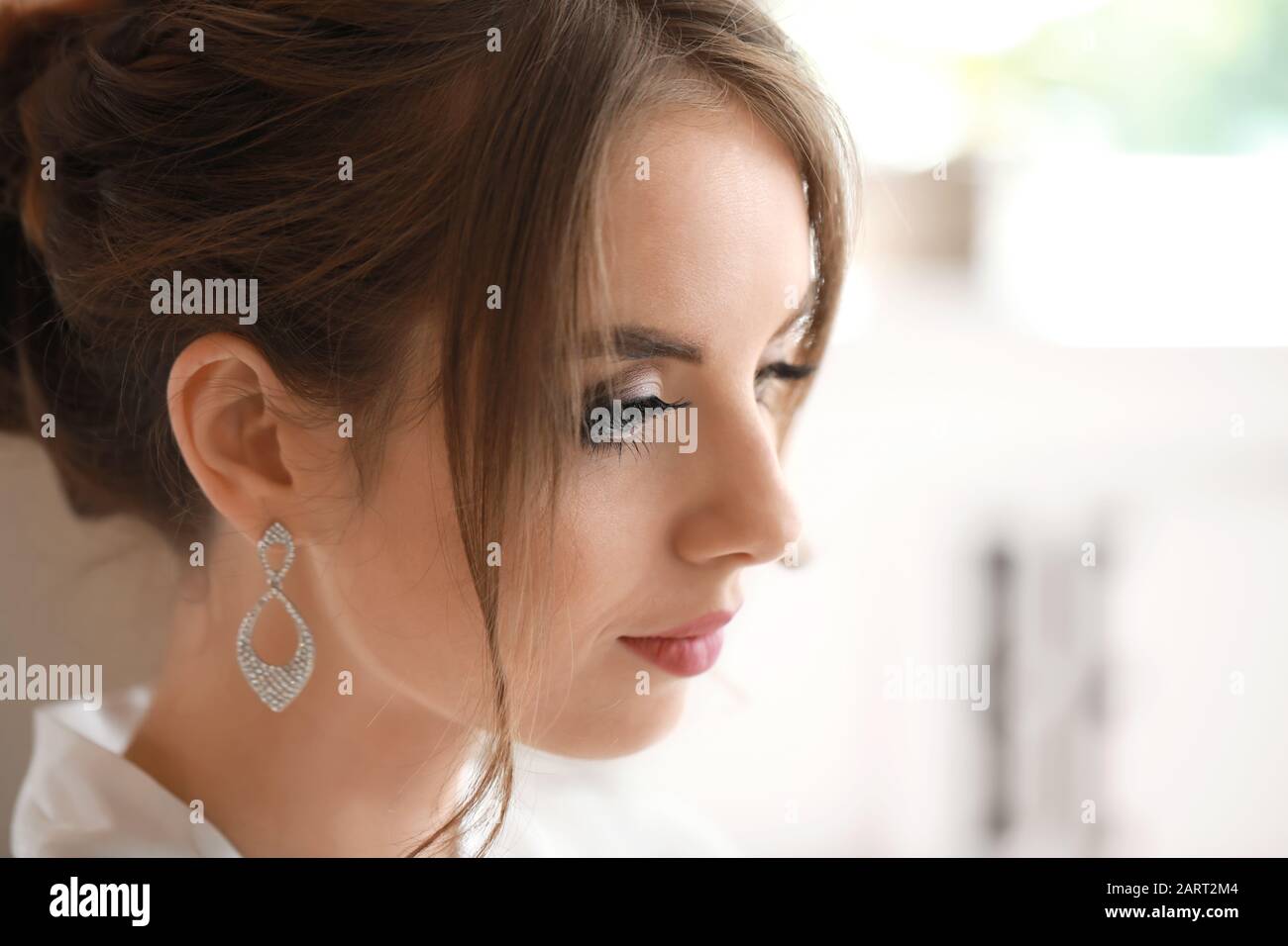 Beautiful young bride before wedding ceremony at home Stock Photo - Alamy