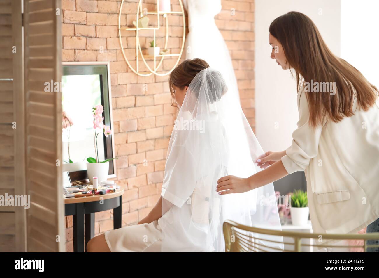 Professional hairdresser working with young bride at home Stock Photo ...