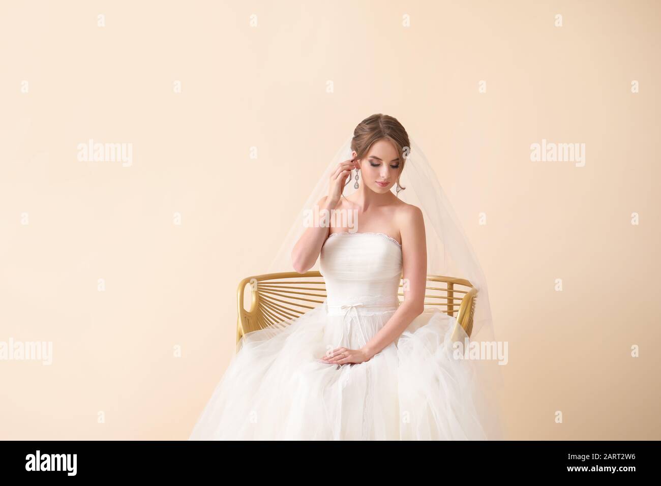 Portrait of beautiful young bride on light background Stock Photo - Alamy