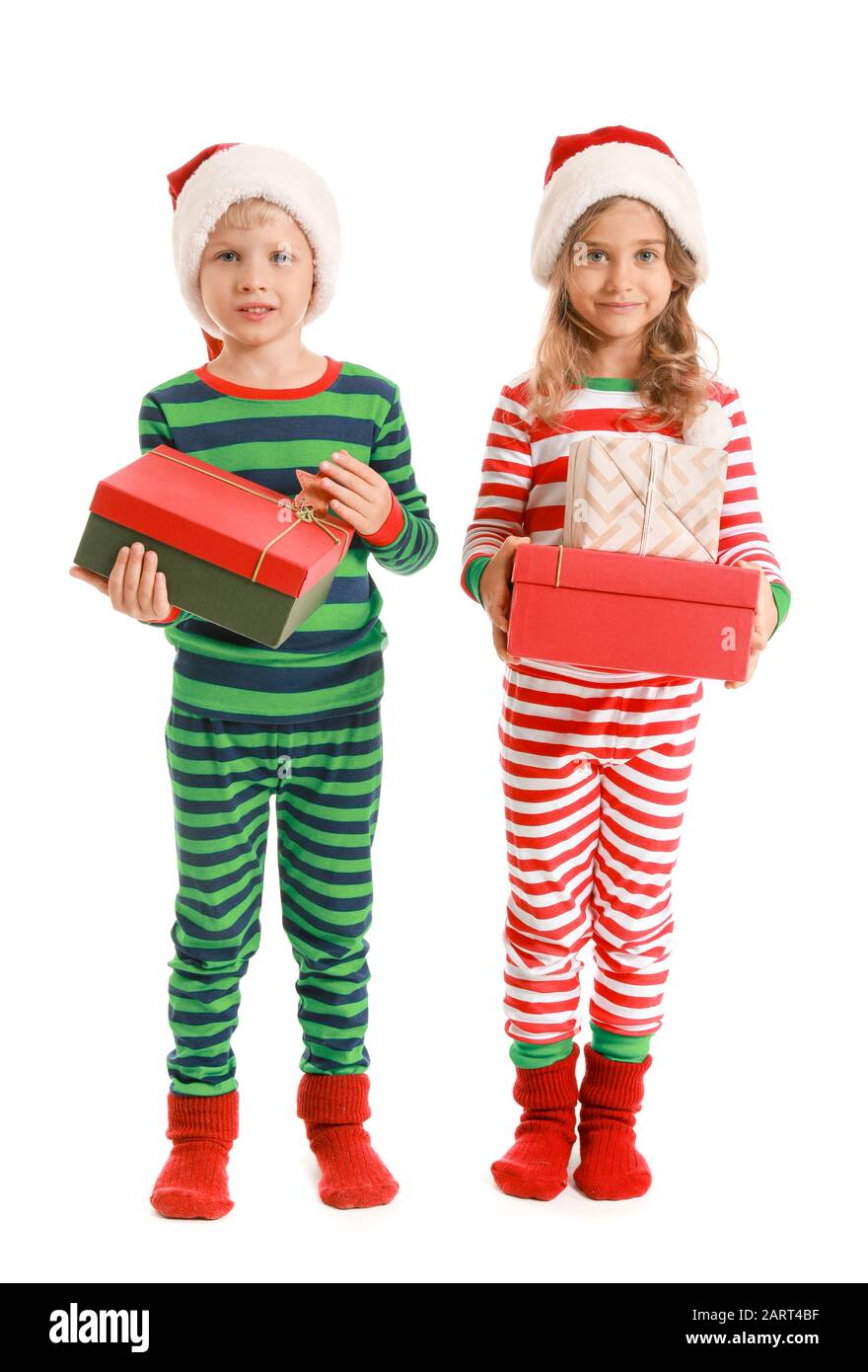 Cute little children with Christmas gifts on white background Stock ...