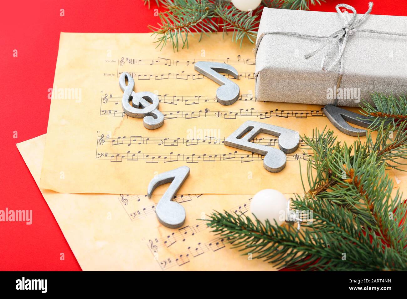 Note sheets, gift and Christmas decor on color background Stock Photo ...