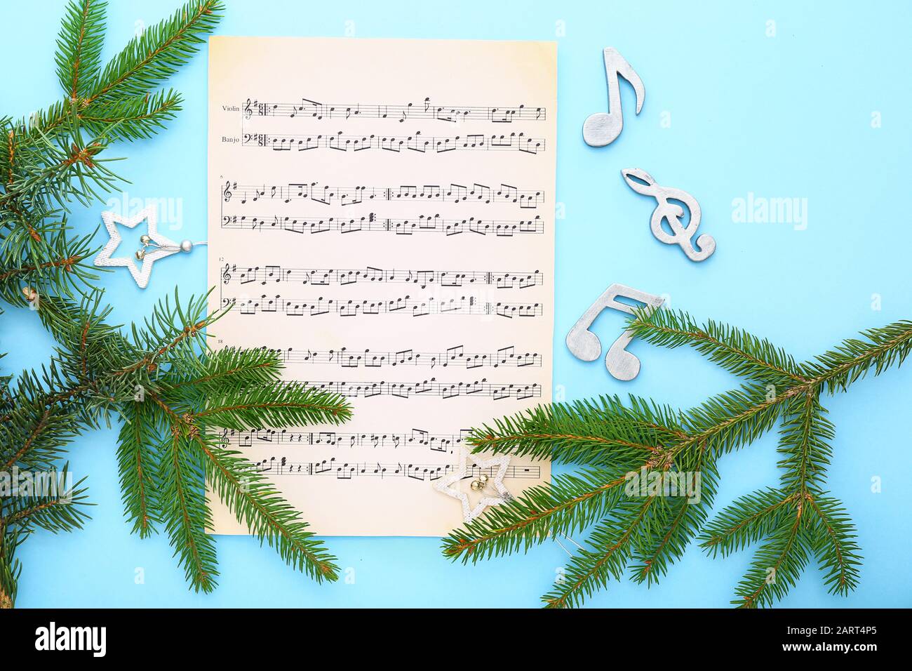 Note sheets and Christmas decor on color background Stock Photo - Alamy
