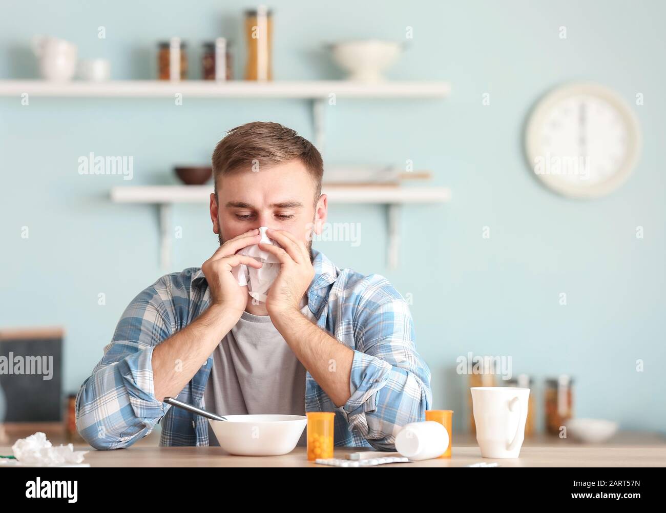 Sick man with chicken soup hi-res stock photography and images - Alamy
