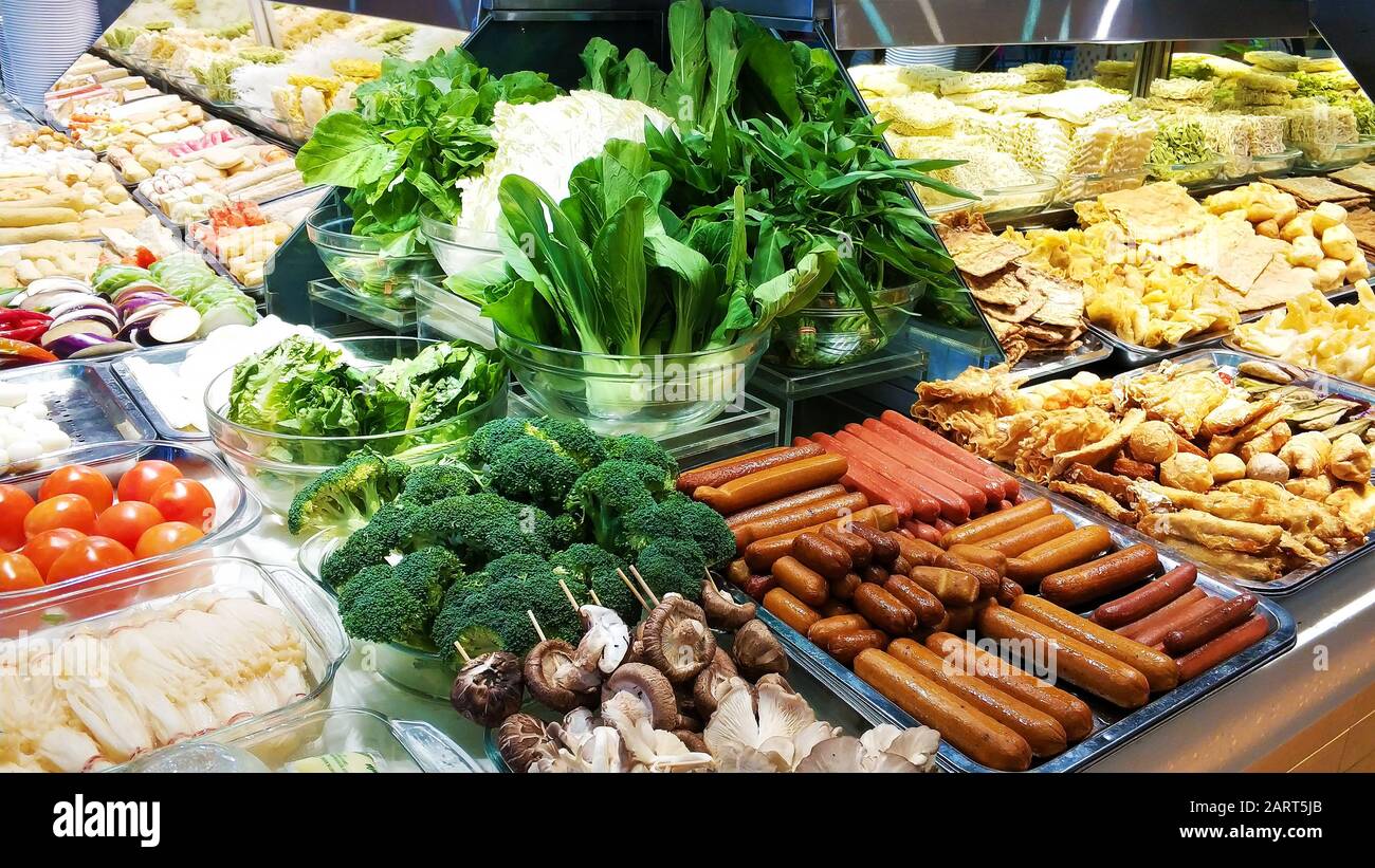 Showcases with a beautiful layout of Chinese food. Food court in the ...