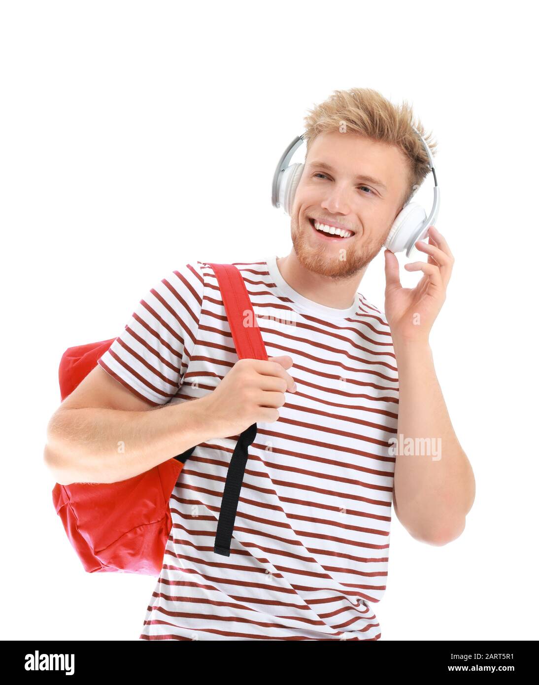 Handsome young man listening to music on white background Stock Photo ...