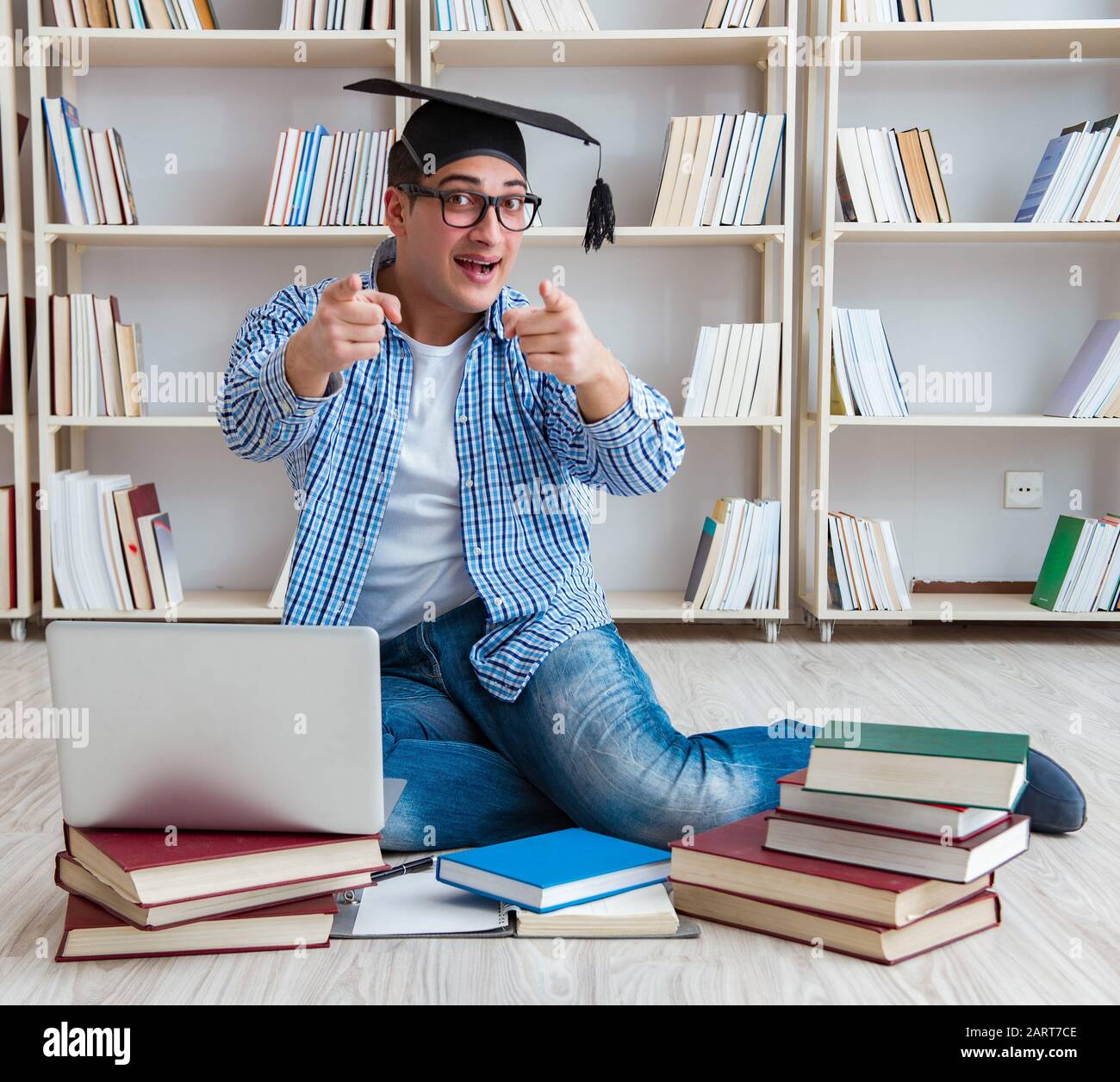 The young student studying with books Stock Photo - Alamy