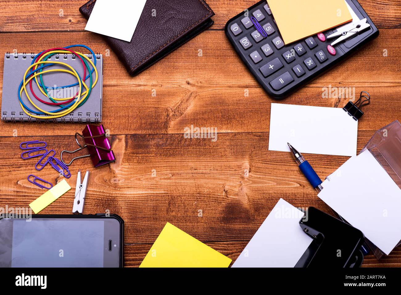 Office tools on wooden background, top view and copy space. Leather ...