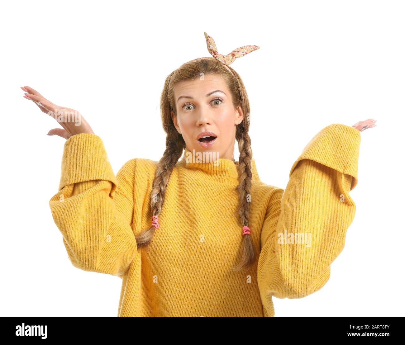 Surprised young woman on white background Stock Photo - Alamy