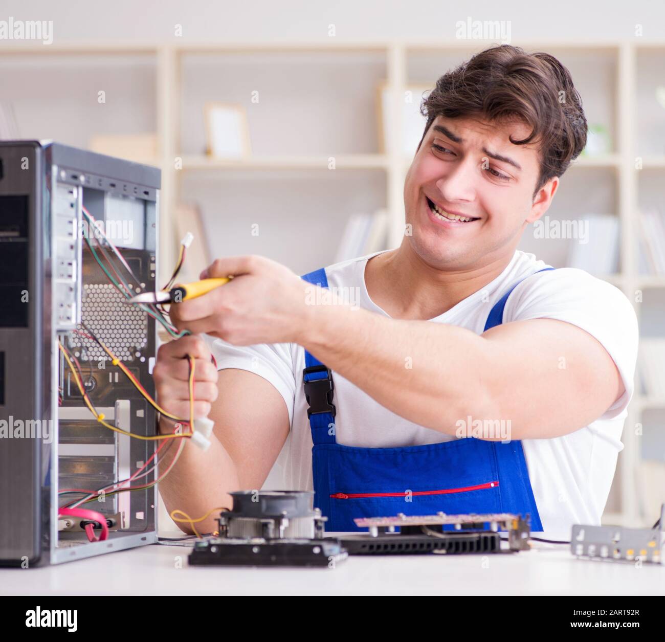 The computer repairman repairing desktop computer Stock Photo - Alamy