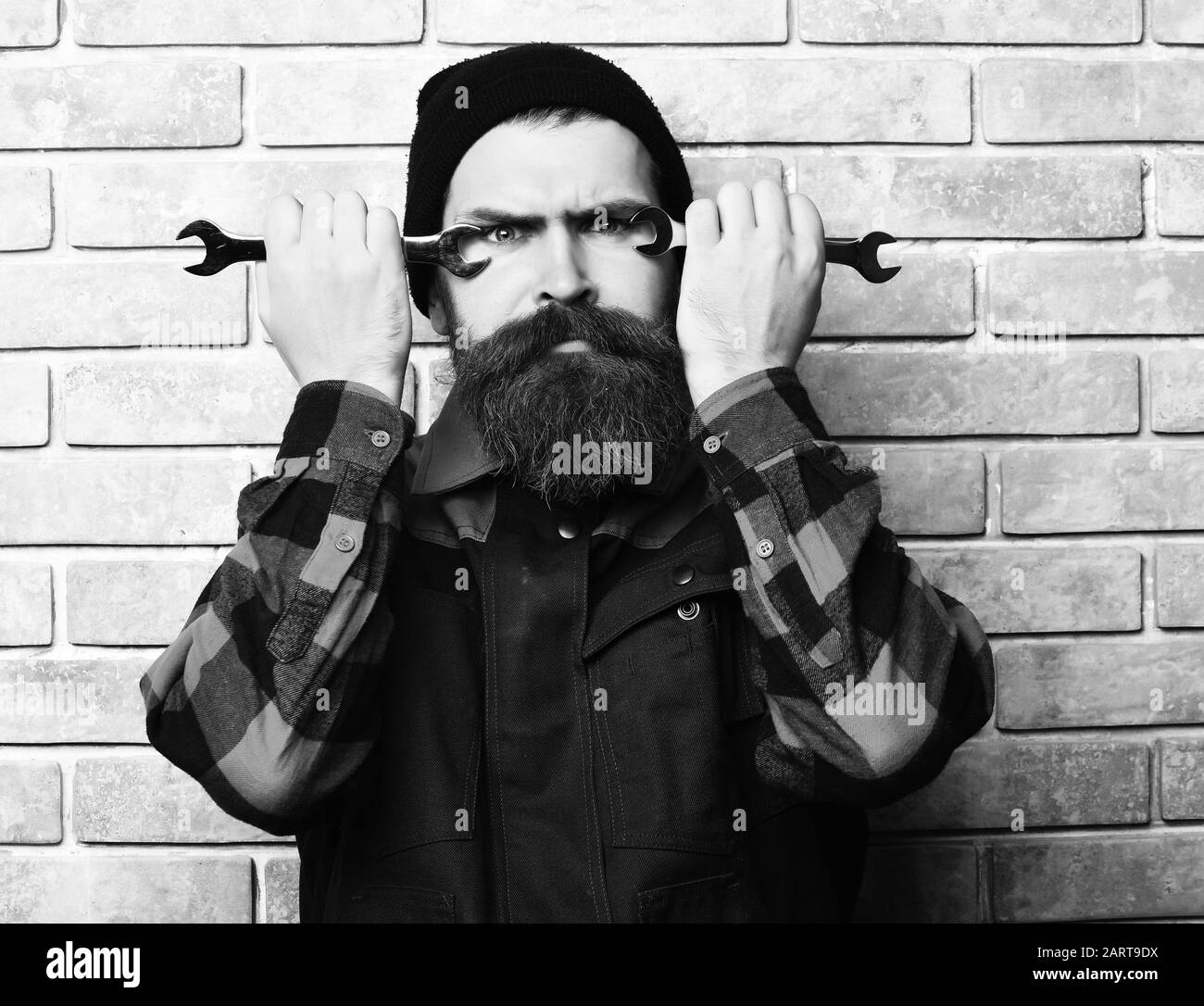 Bearded man, long beard. Brutal caucasian mechanic, unshaven hipster in ...