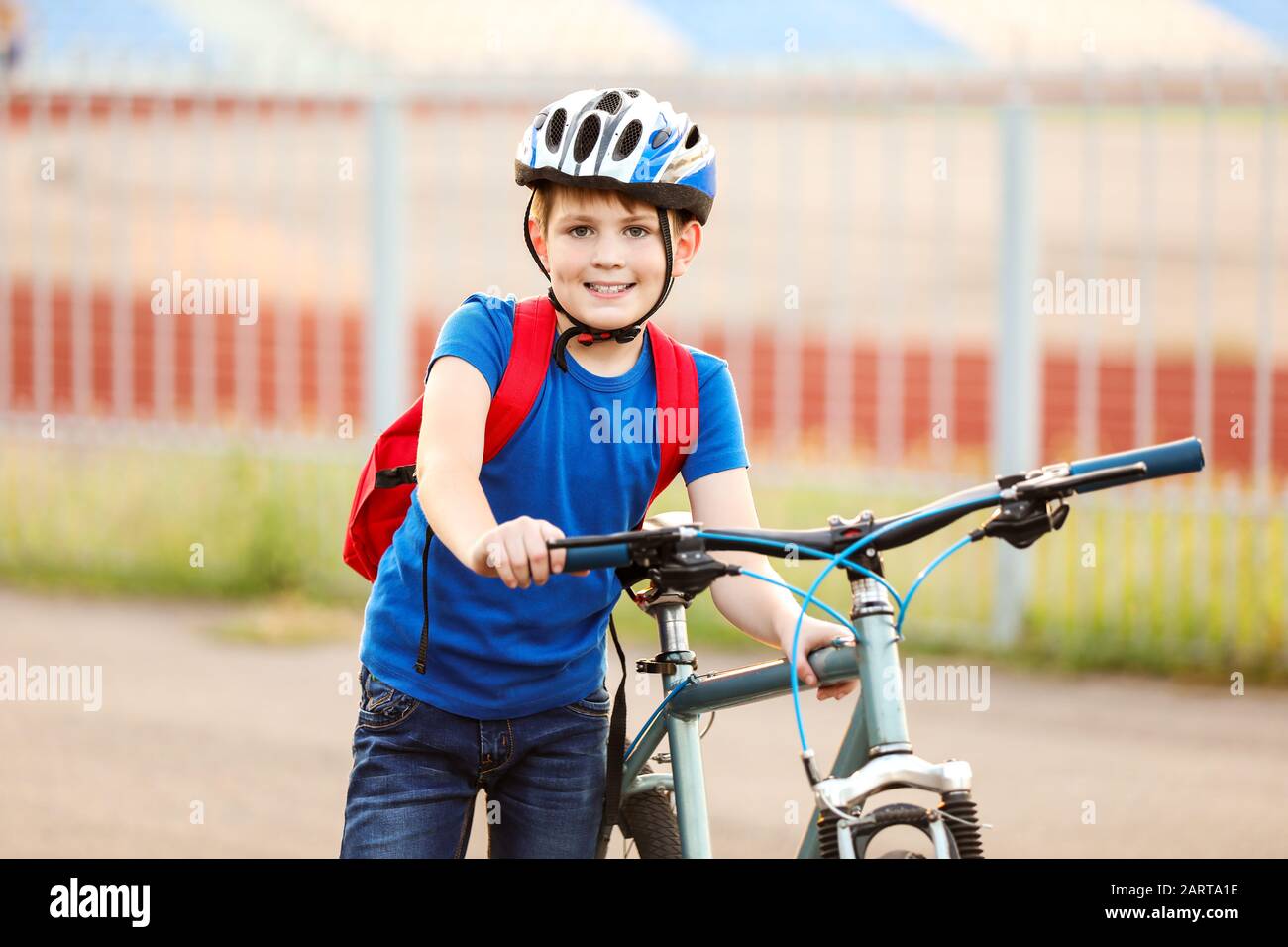 Cute boy riding bicycle outdoors Stock Photo - Alamy