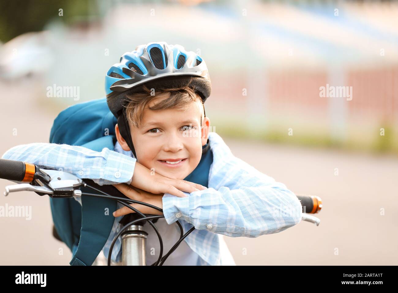 Cute boy riding bicycle outdoors Stock Photo - Alamy