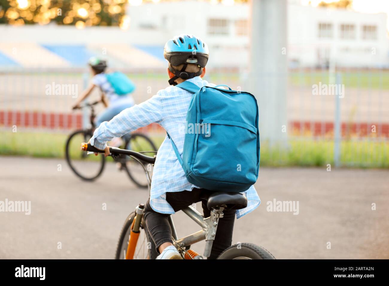 Cute boy riding bicycle outdoors Stock Photo - Alamy