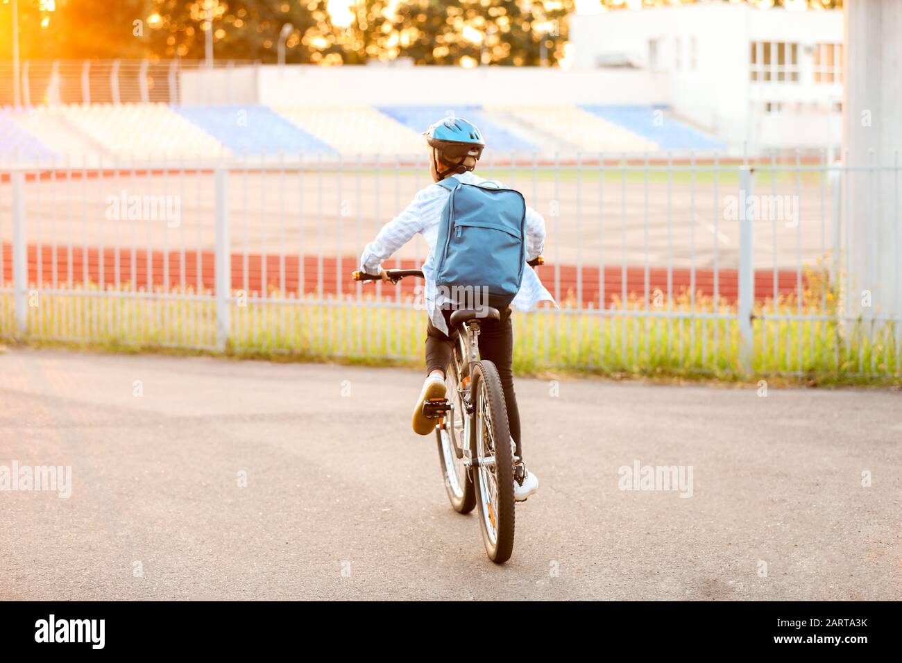 Cute boy riding bicycle outdoors Stock Photo - Alamy