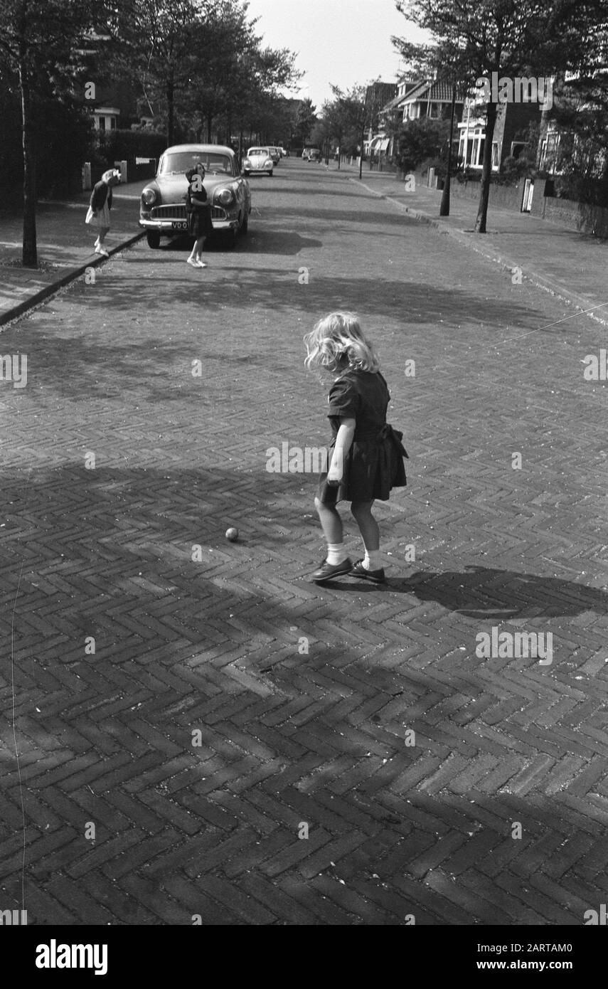 Children playing on the roadway Date: June 6, 1963 Keywords: Children ...