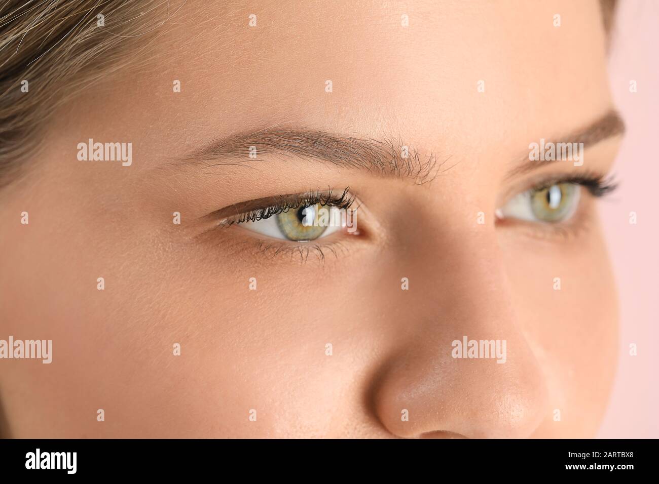 Young woman with beautiful eyebrows, closeup Stock Photo - Alamy