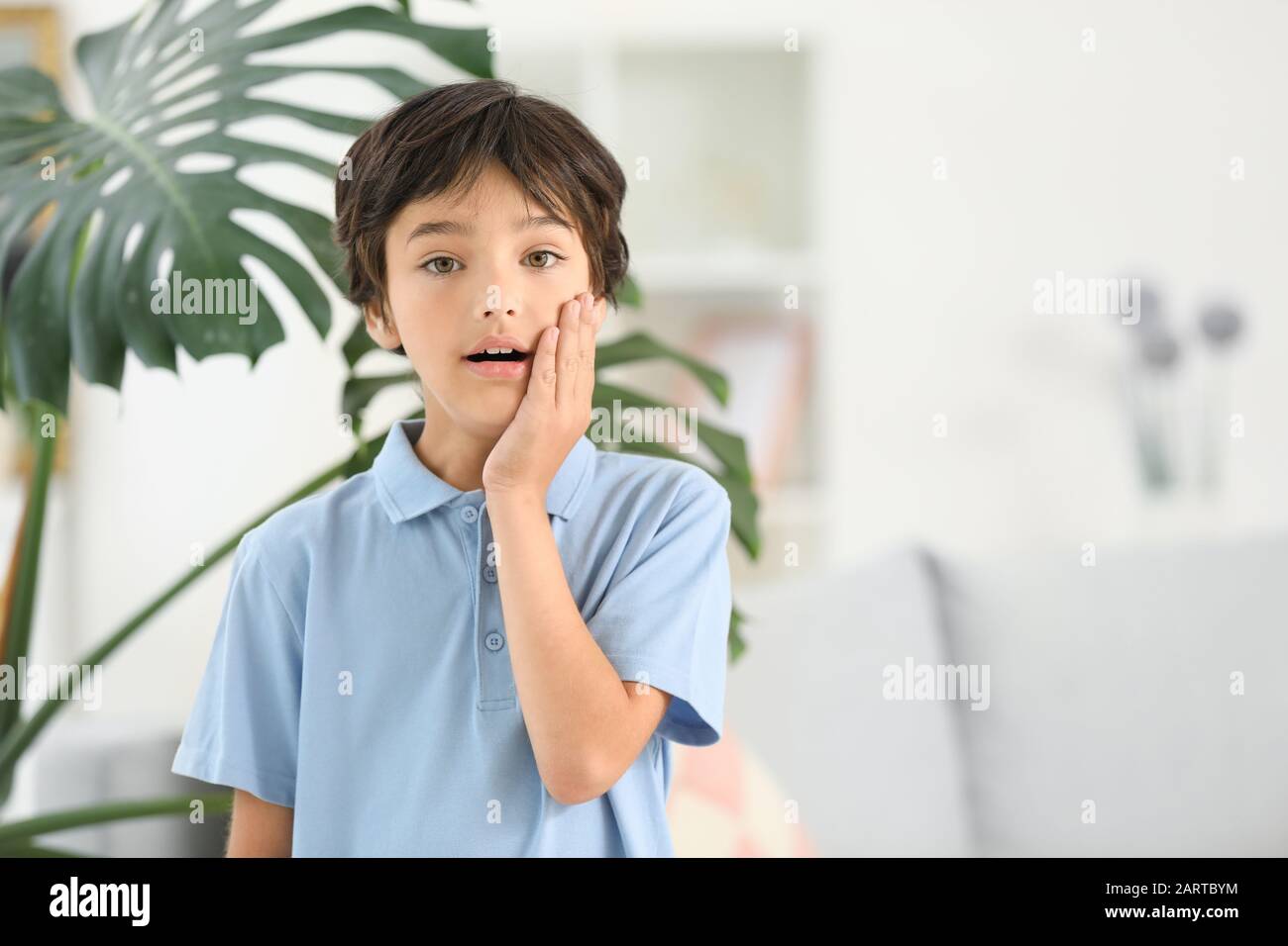 Surprised little boy at home Stock Photo - Alamy