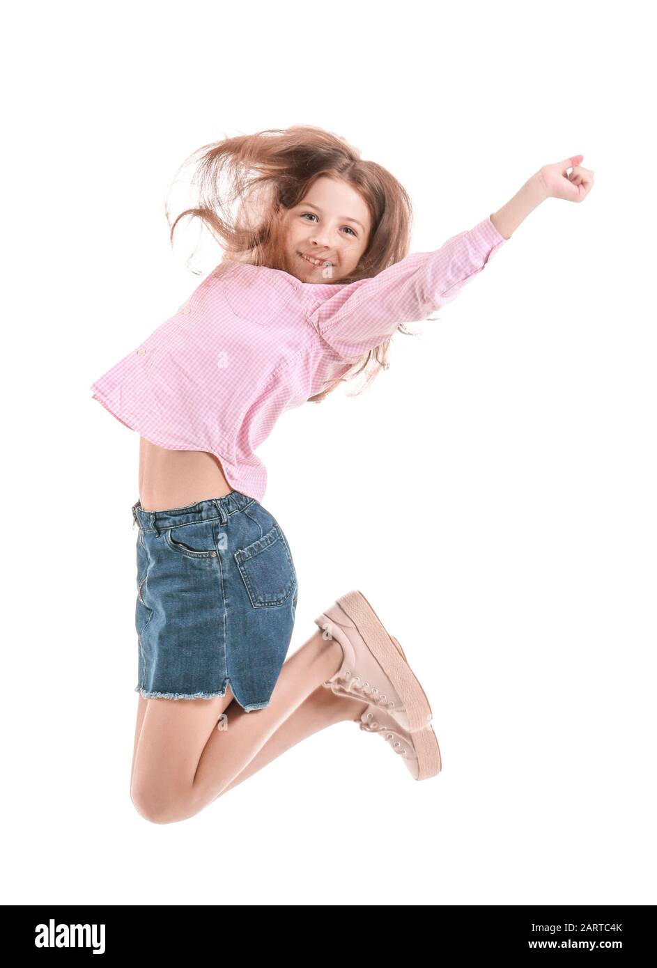 Jumping little girl on white background Stock Photo - Alamy
