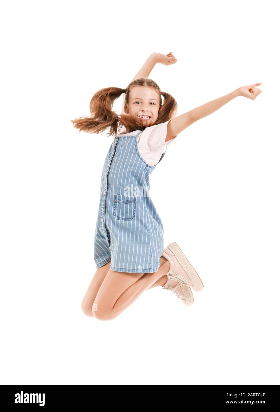 Jumping little girl on white background Stock Photo - Alamy