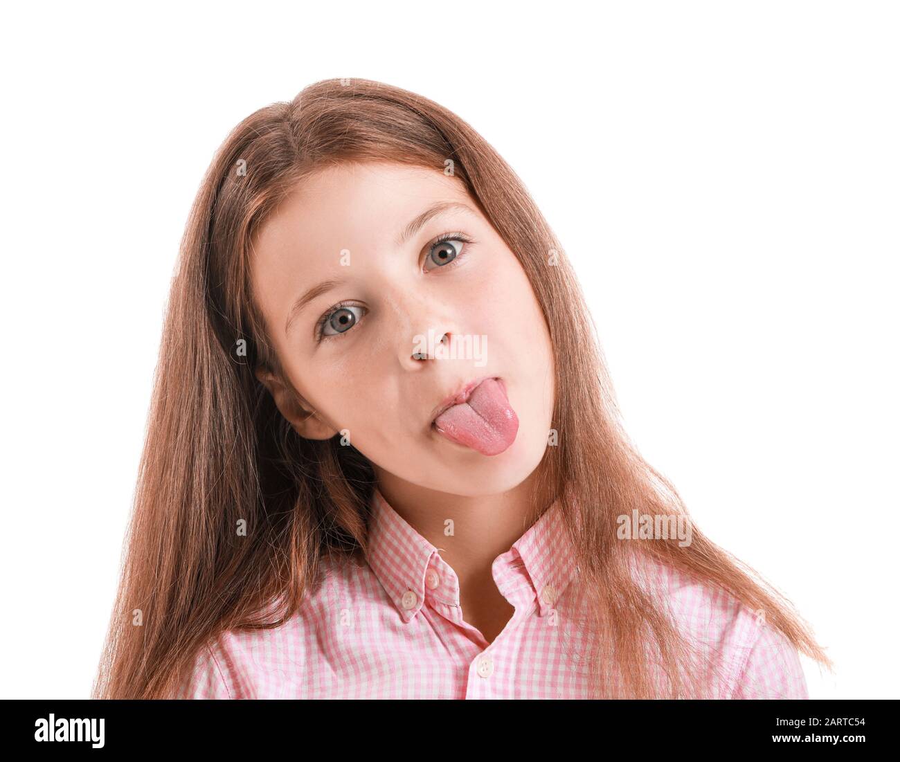 Grimacing little girl on white background Stock Photo - Alamy