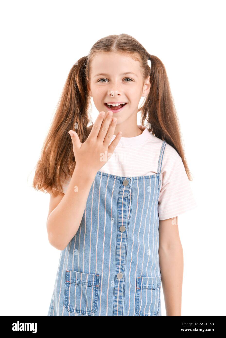 Excited little girl on white background Stock Photo - Alamy