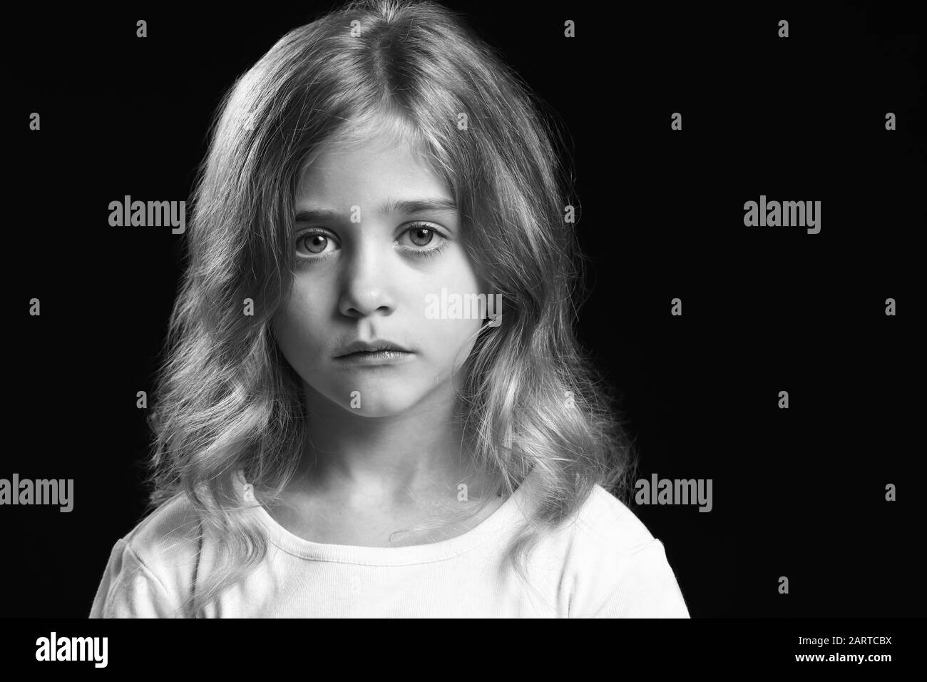 Black and white portrait of sad little girl on dark background Stock ...