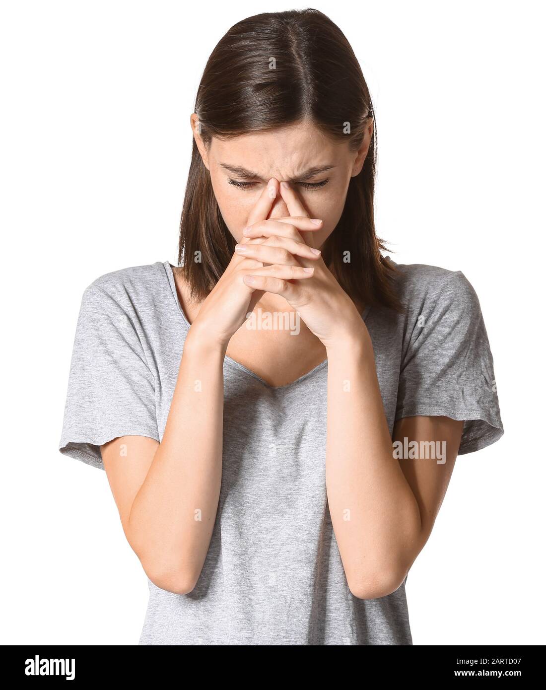 Stressed young woman on white background Stock Photo - Alamy
