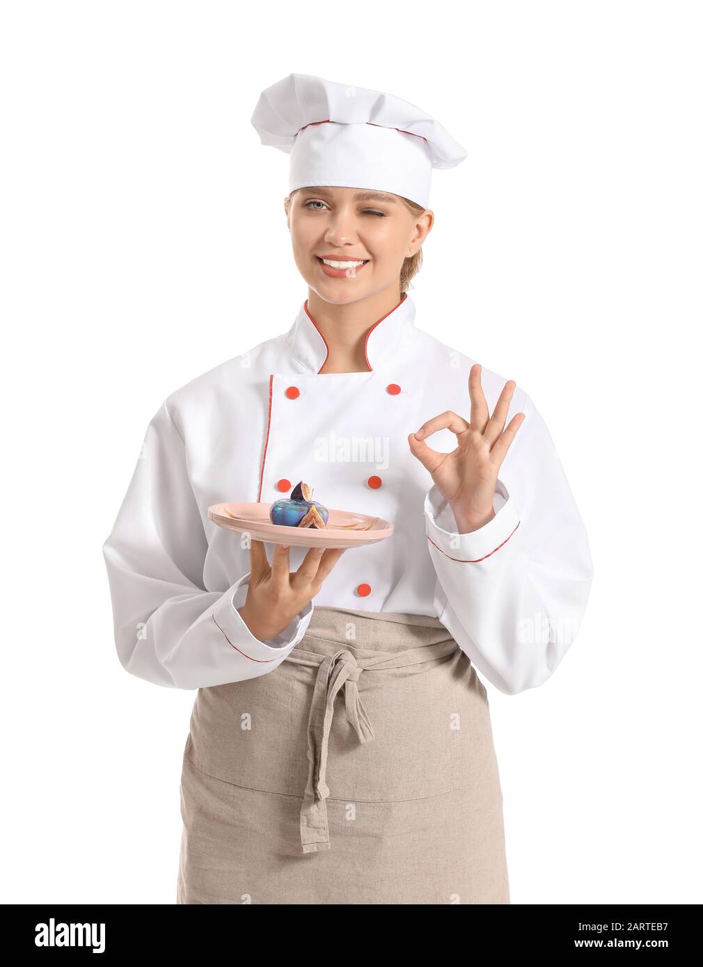 Female confectioner with tasty dessert on white background Stock Photo ...