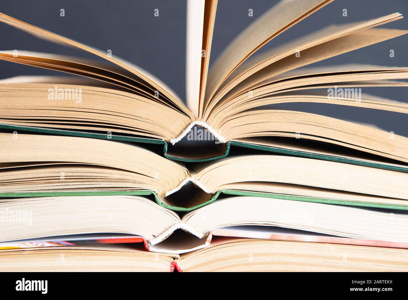 A simple composition of hardback books, raw books. Open books. Stacking ...