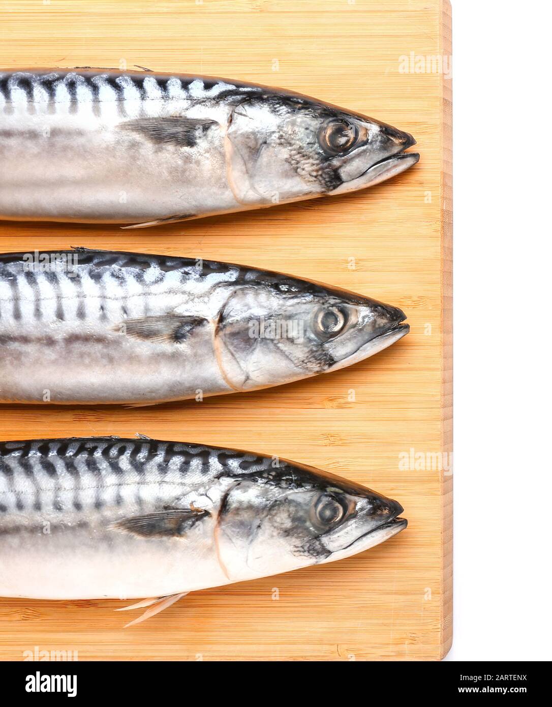 Board with raw mackerel fish on white background Stock Photo - Alamy