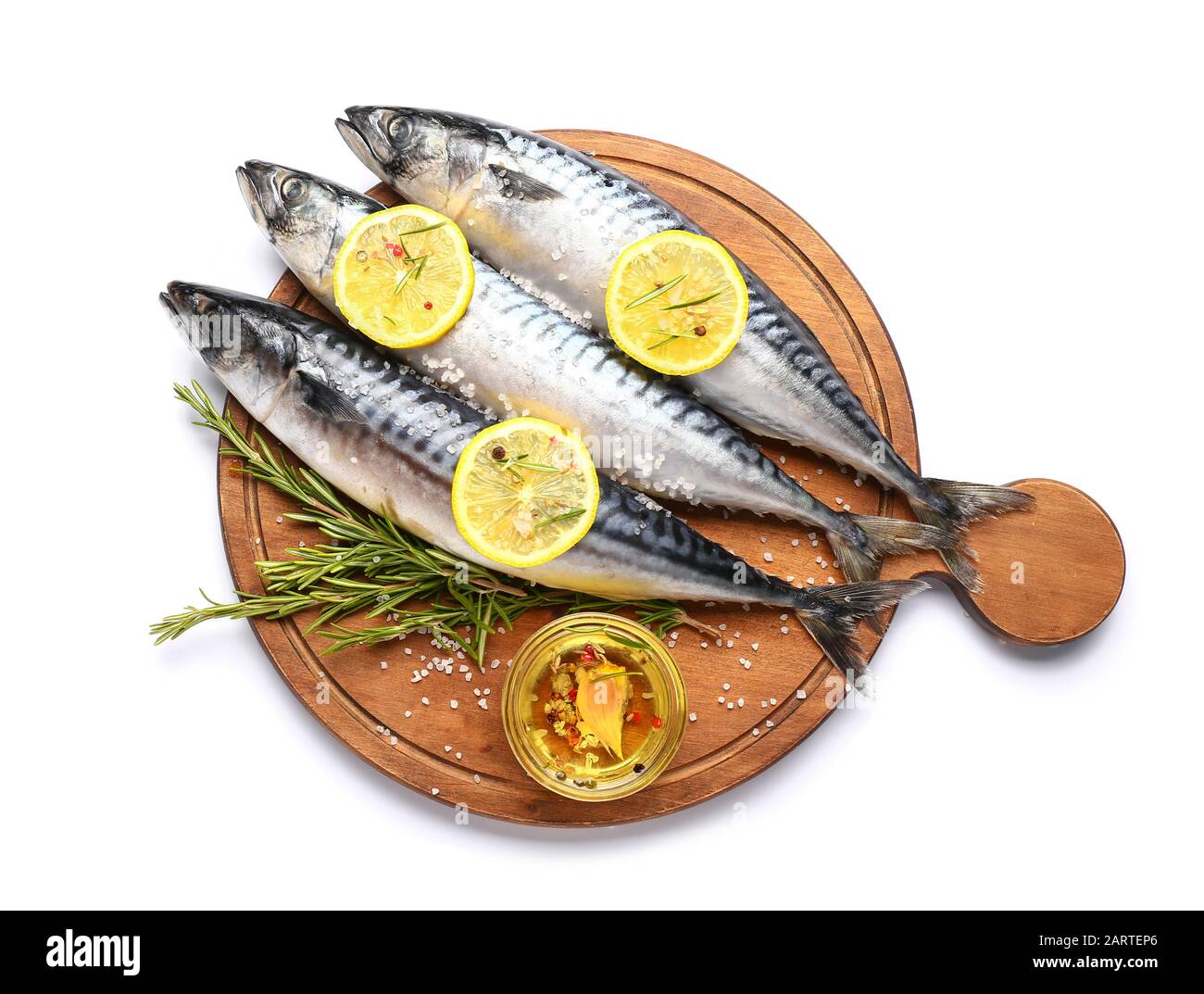 Board with raw mackerel fish and spices on white background Stock Photo ...