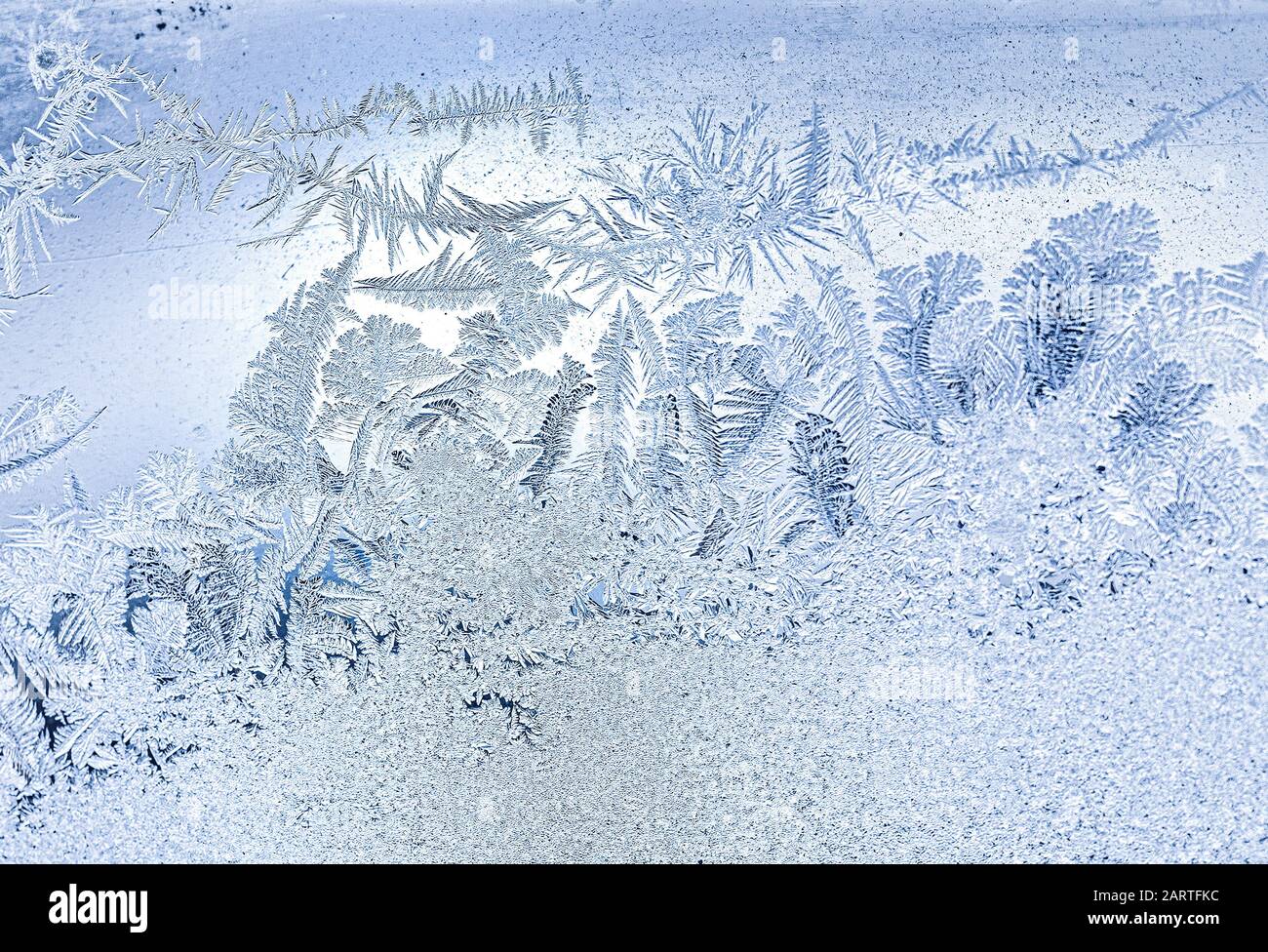Frosty natural pattern on winter window, ornamental frost on the glass ...