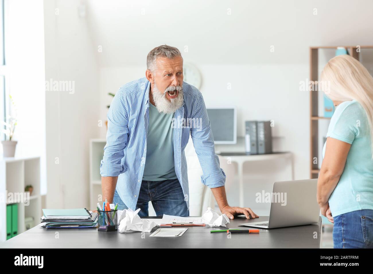Angry mature boss scolding her secretary in office Stock Photo - Alamy