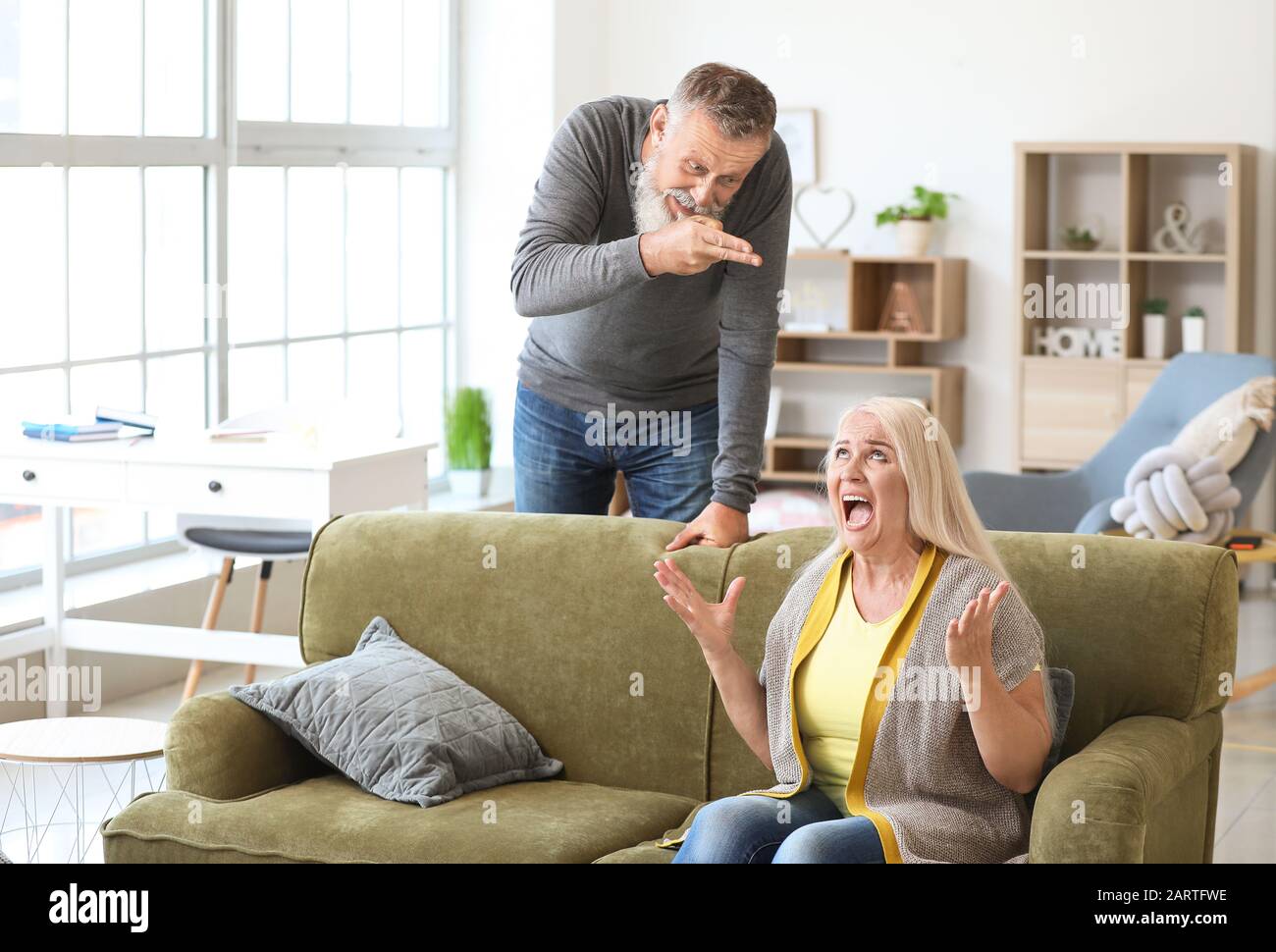 Angry mature couple having arguments at home Stock Photo - Alamy