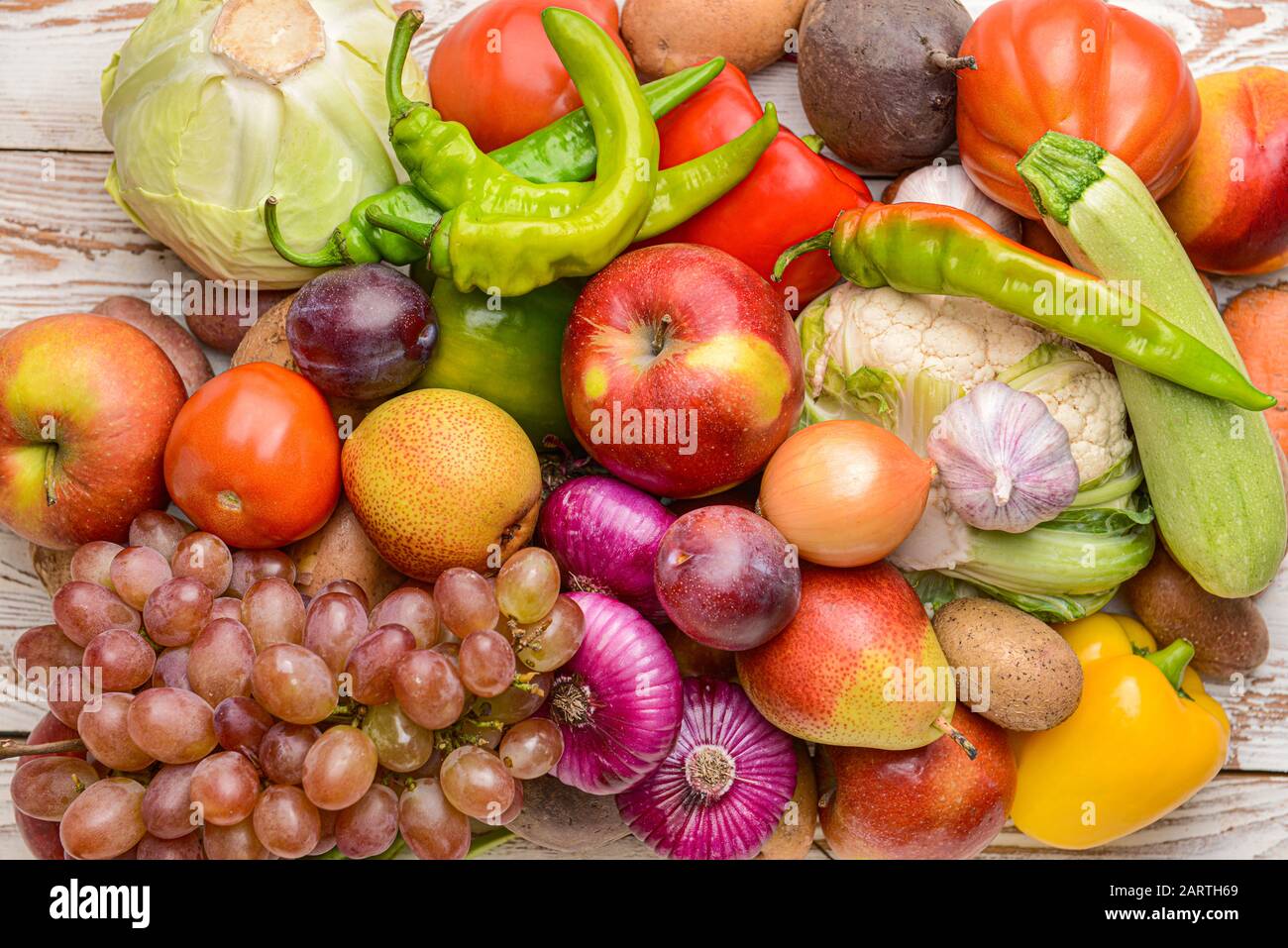 Many healthy vegetables and fruits on table Stock Photo - Alamy