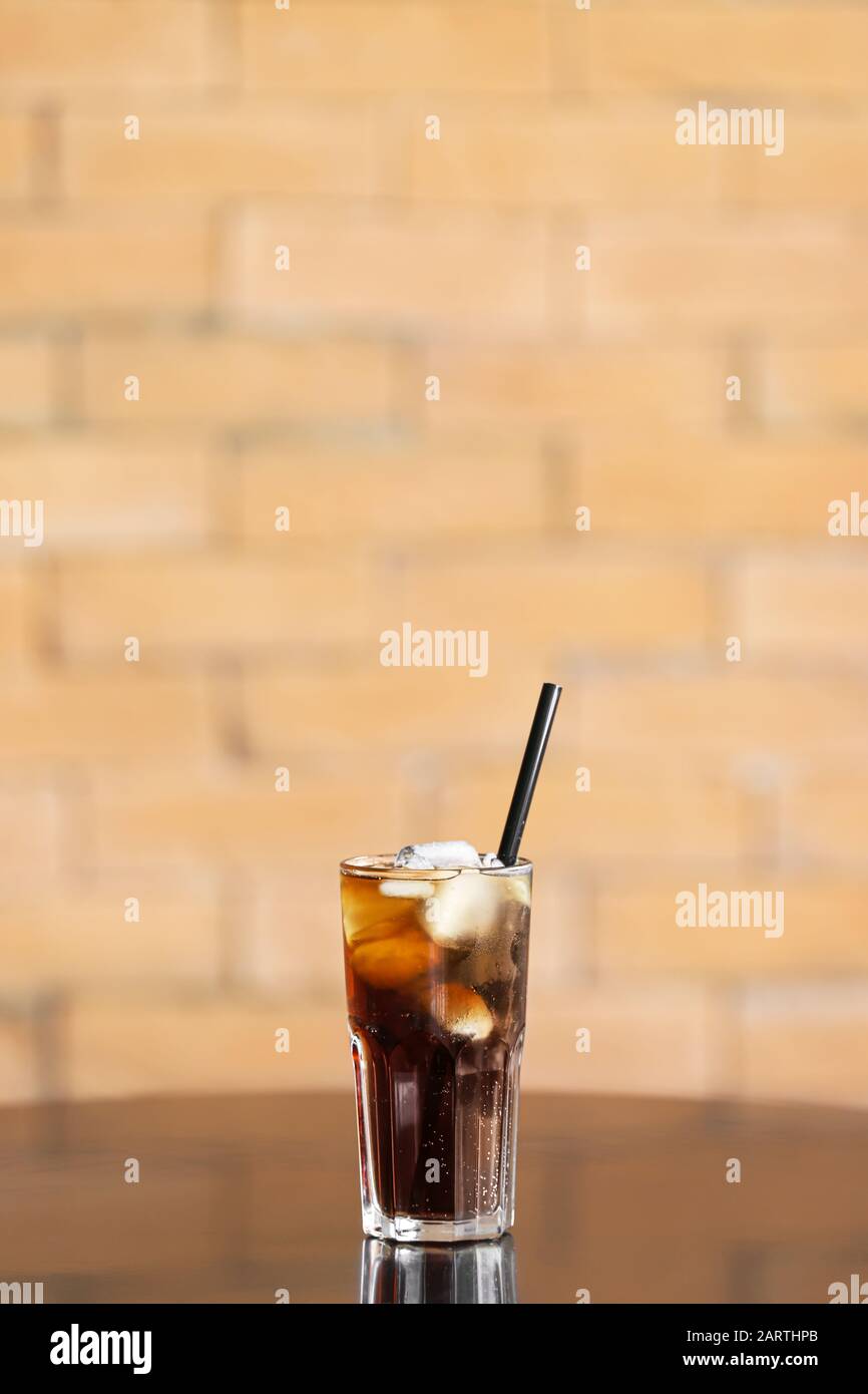 Glass of cold cola on table Stock Photo - Alamy