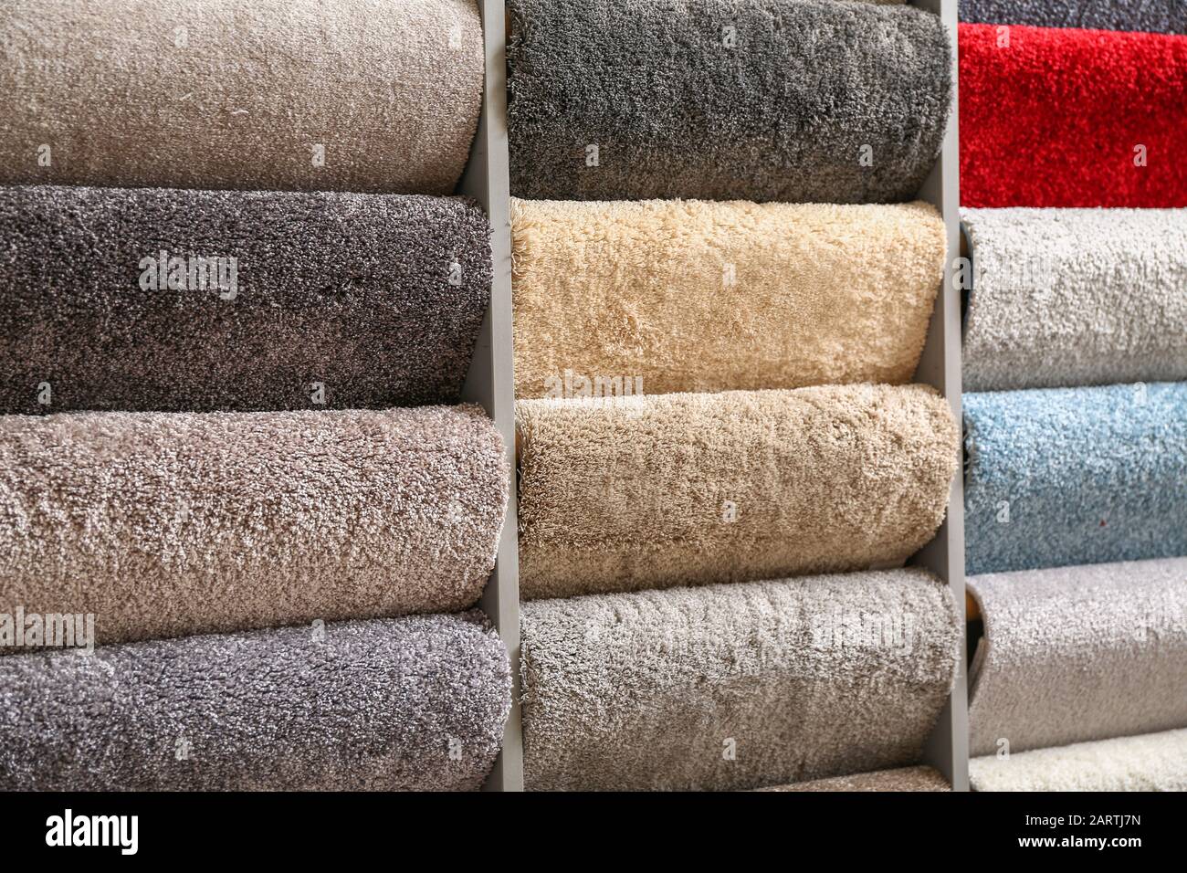Different samples of carpets in shop Stock Photo - Alamy