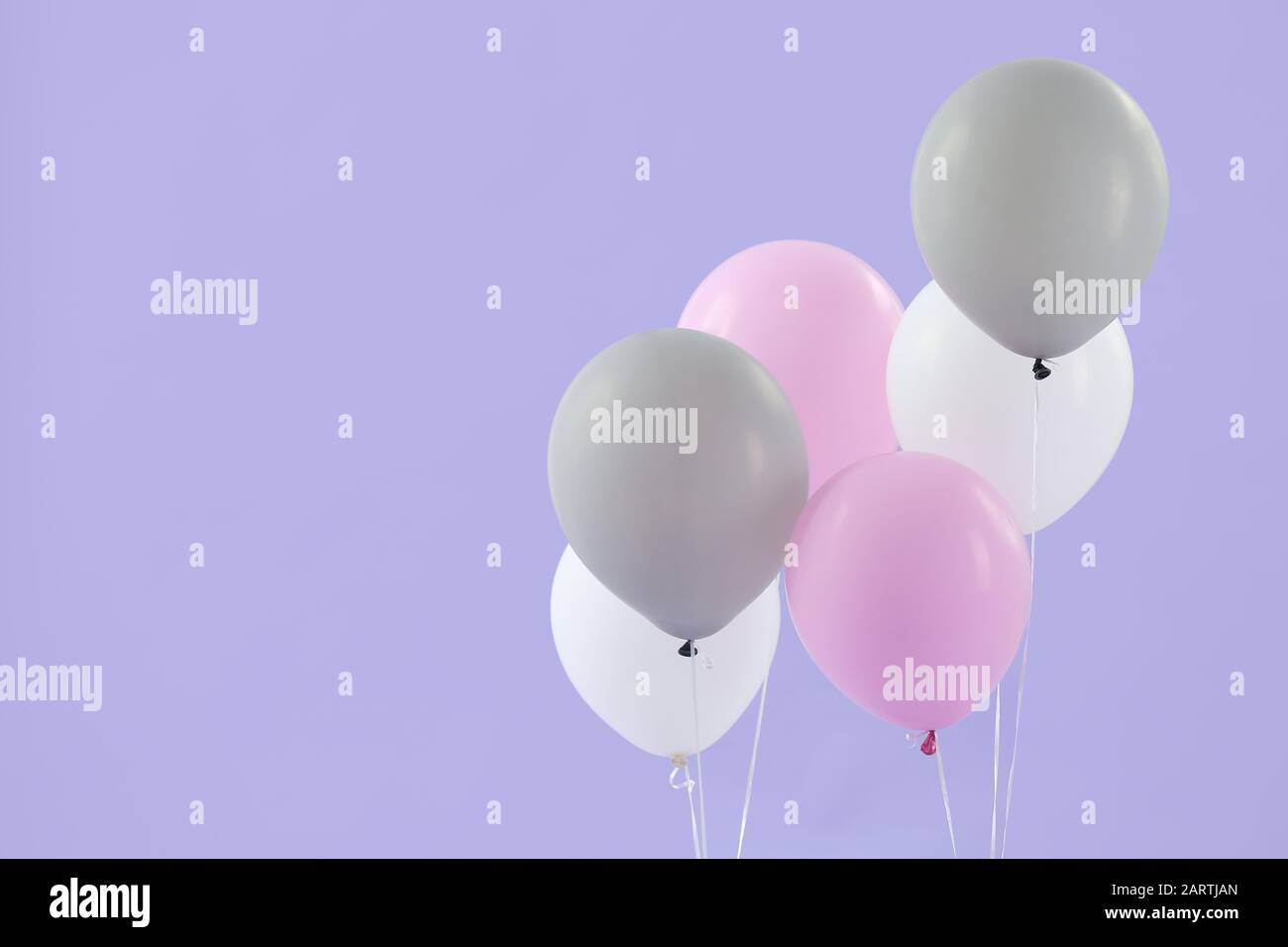 Different balloons on color background Stock Photo - Alamy