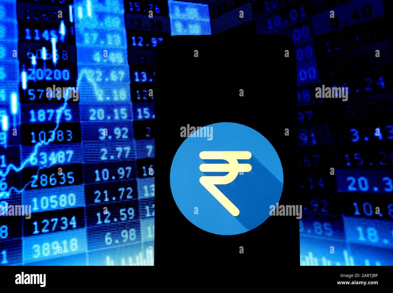 In this photo illustration an Indian Rupees logo seen displayed on a ...