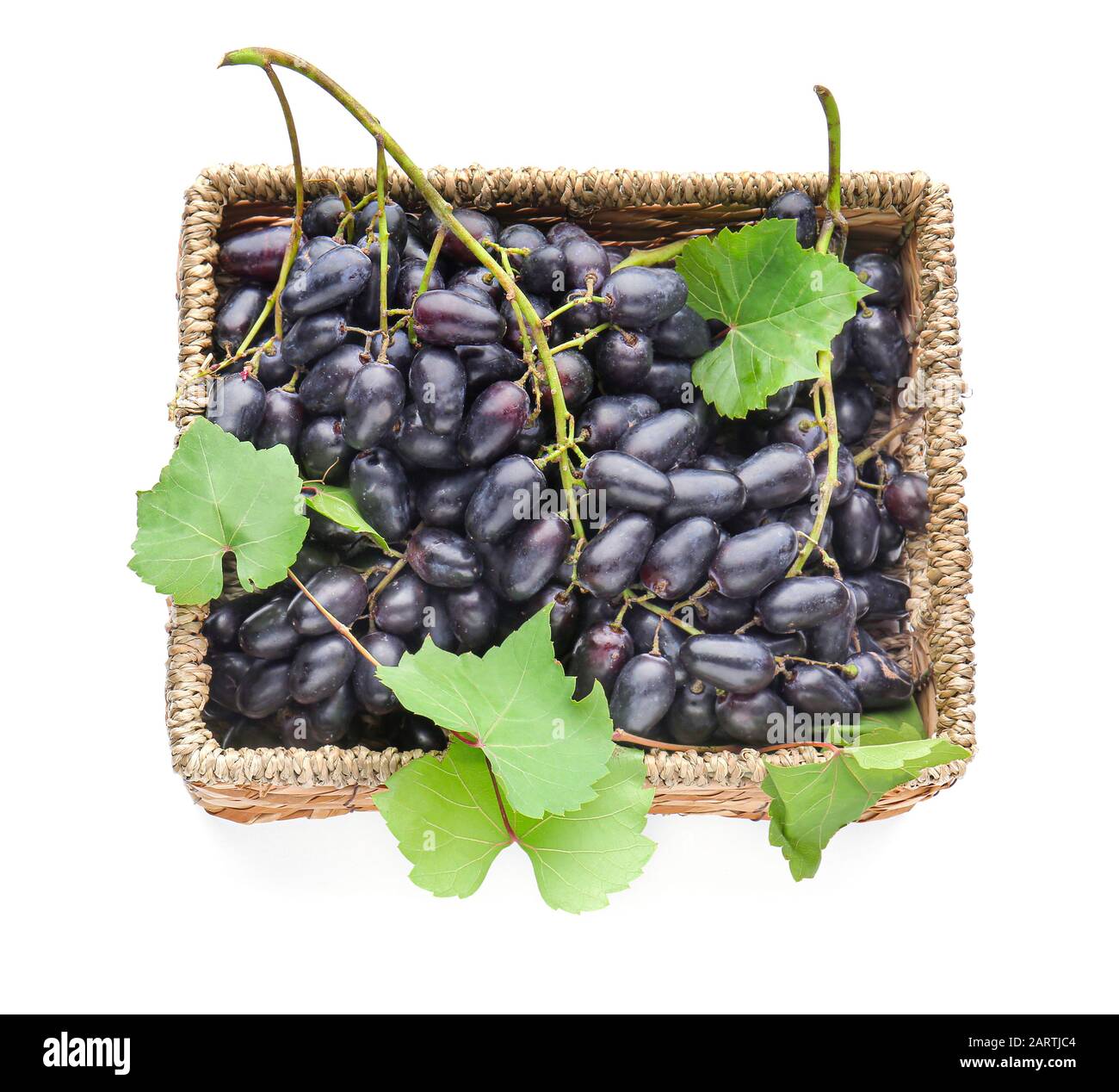 Tasty sweet grapes in basket on white background Stock Photo - Alamy