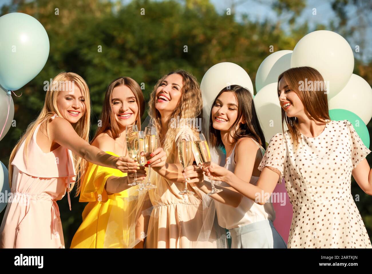 Beautiful young women with champagne at hen party outdoors Stock Photo ...