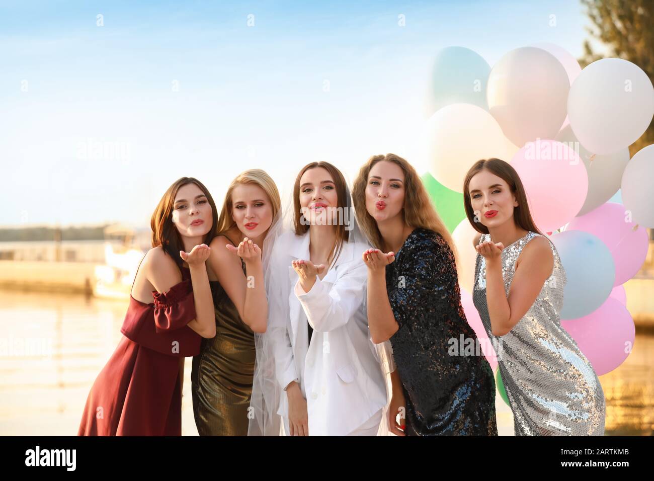 Beautiful young women at hen party near river Stock Photo - Alamy