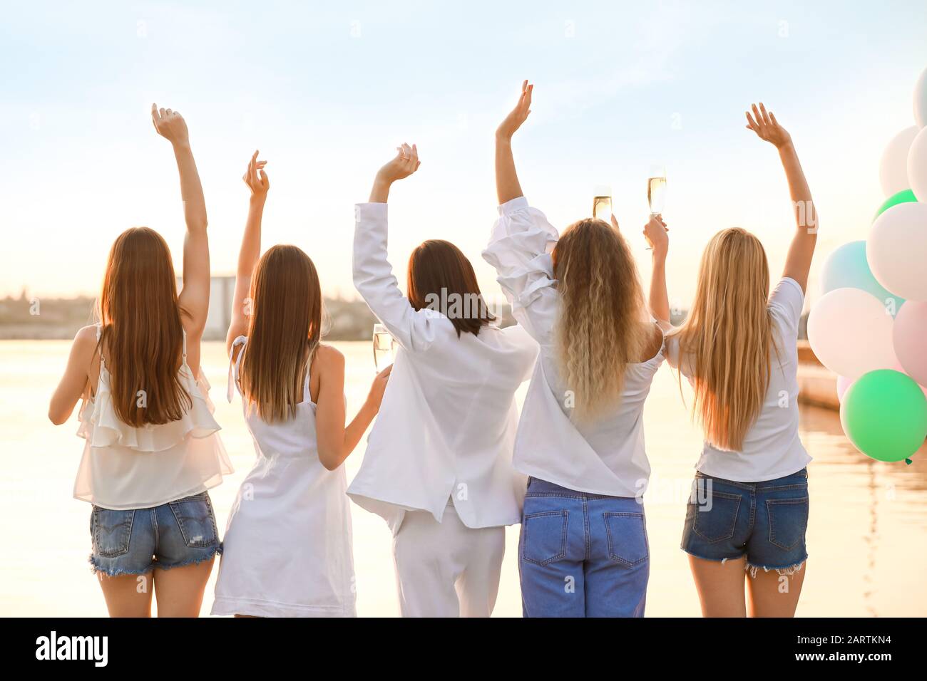Beautiful young women at hen party near river Stock Photo - Alamy
