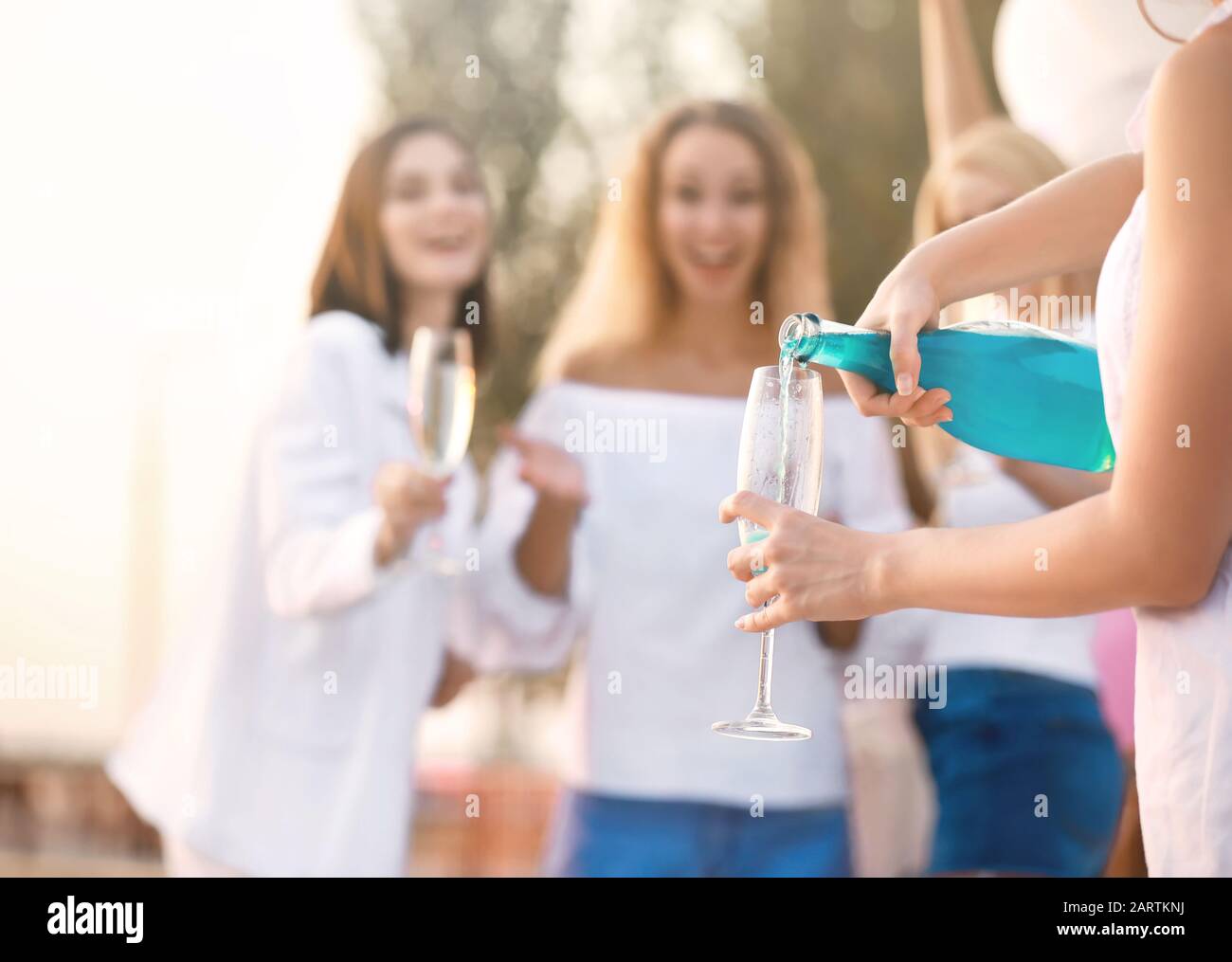 Beautiful young women drinking champagne at hen party outdoors Stock ...