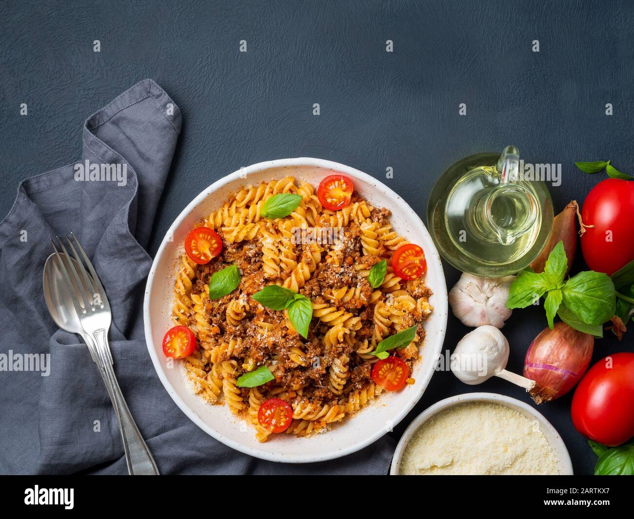 Bolognese pasta. Fusilli with tomato sauce, ground minced beef, basil ...