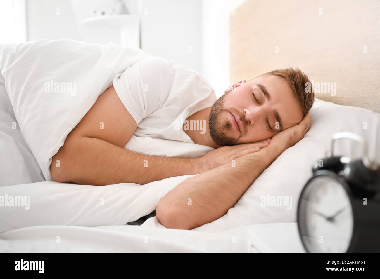 Morning of young man sleeping in bed Stock Photo - Alamy