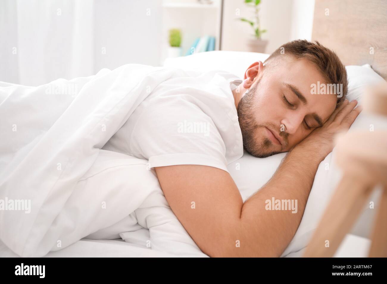 Morning of young man sleeping in bed Stock Photo - Alamy